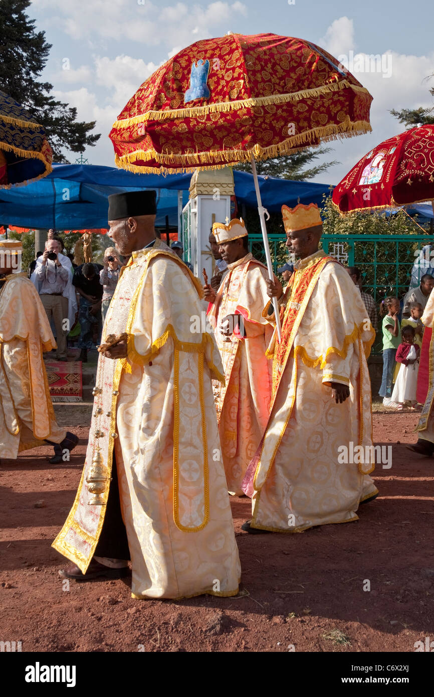 Christian Orthodox devotees walking under their ceremonial umbrella at ...