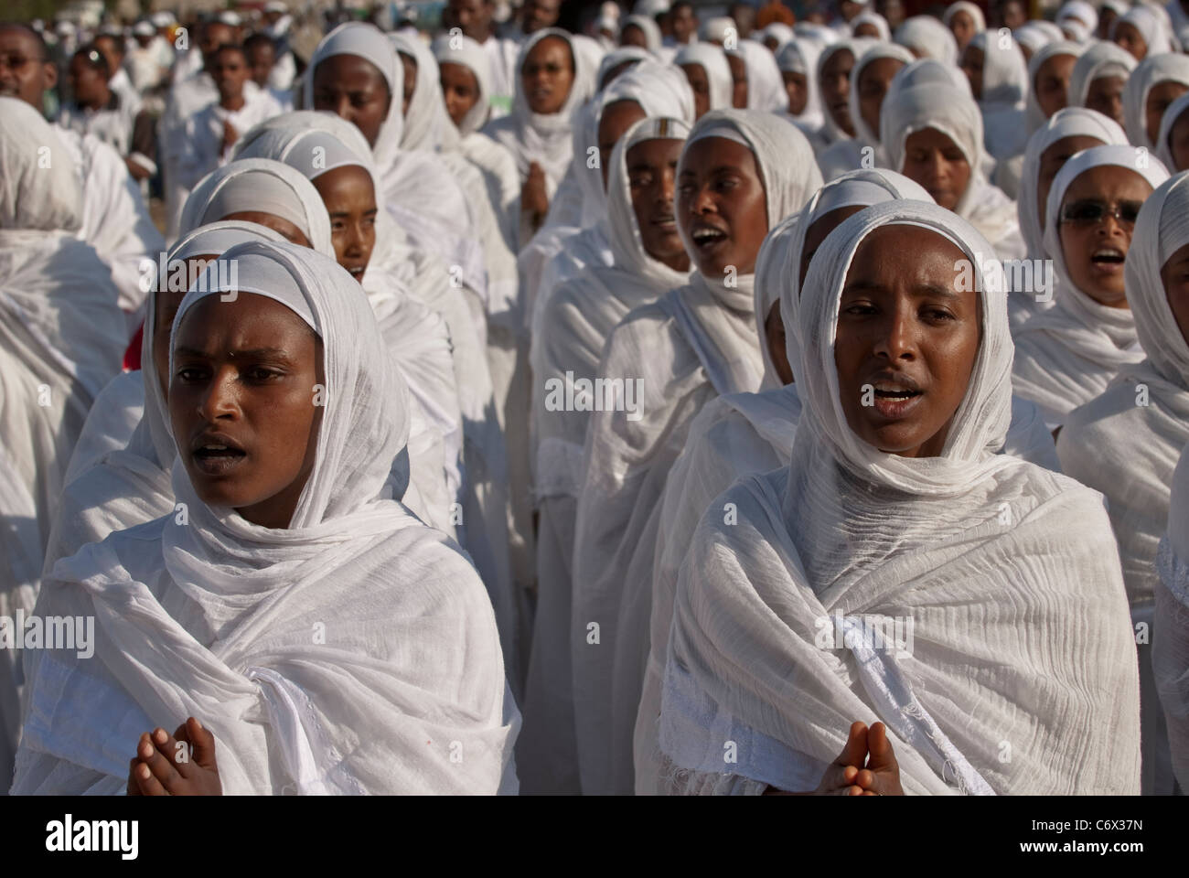 Christian Orthodox devotees singing, clapping and praying at the Timket ...
