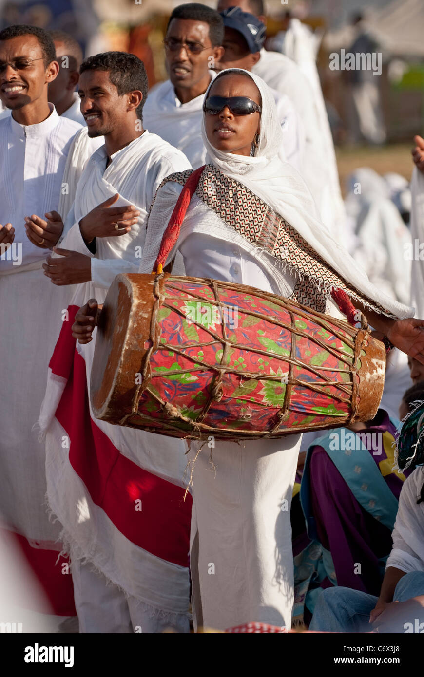 Christian Orthodox devotees playing a traditional drum at the Timket ...