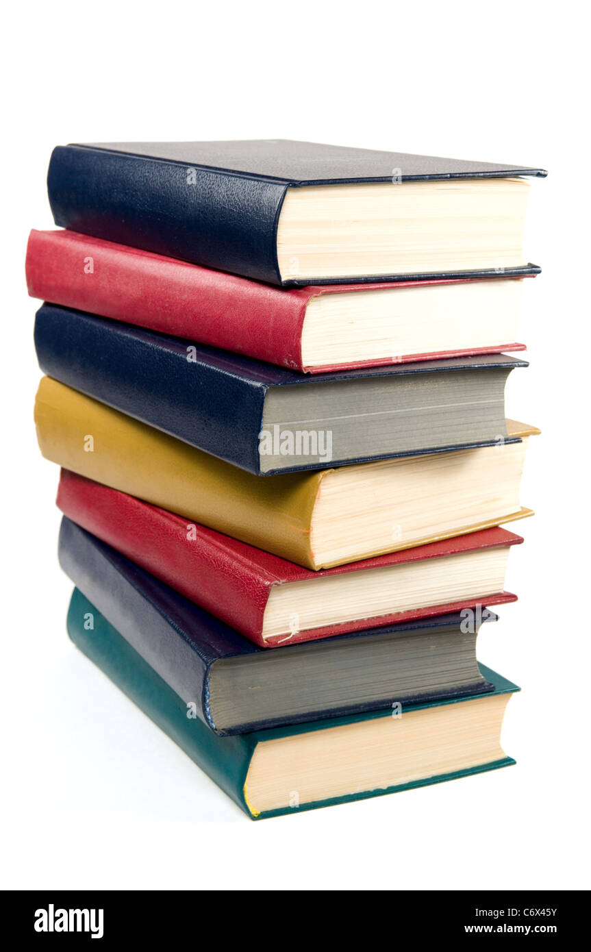 Heap of books of different colour it is isolated on a white background ...