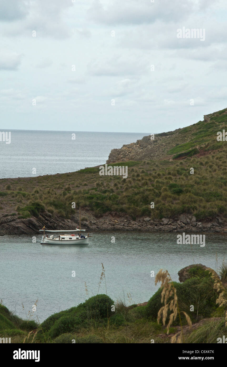 Menorcian Fishing boat in a small bay at Cavalleria, Menorca Stock ...