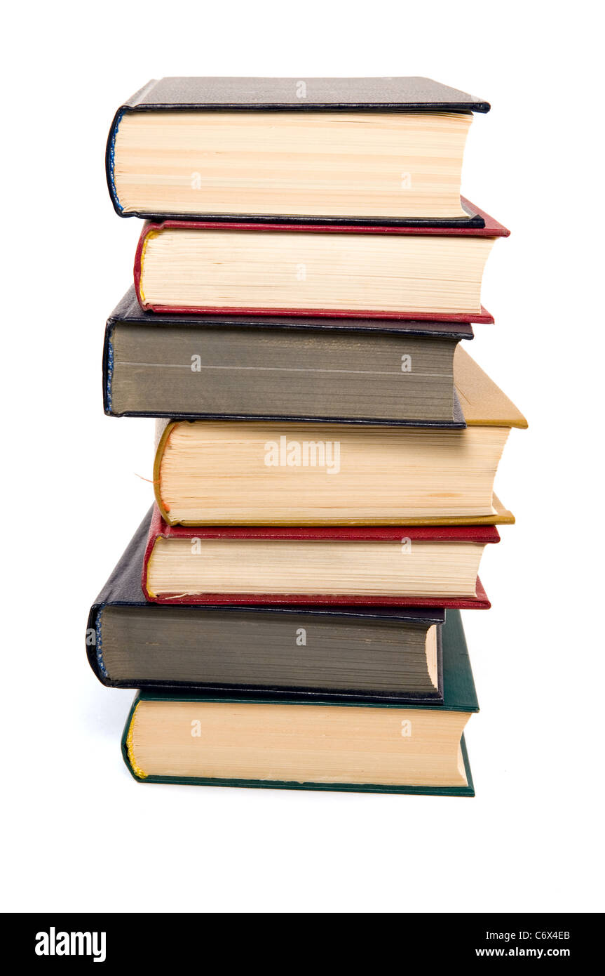 Heap of books of different colour it is isolated on a white background ...