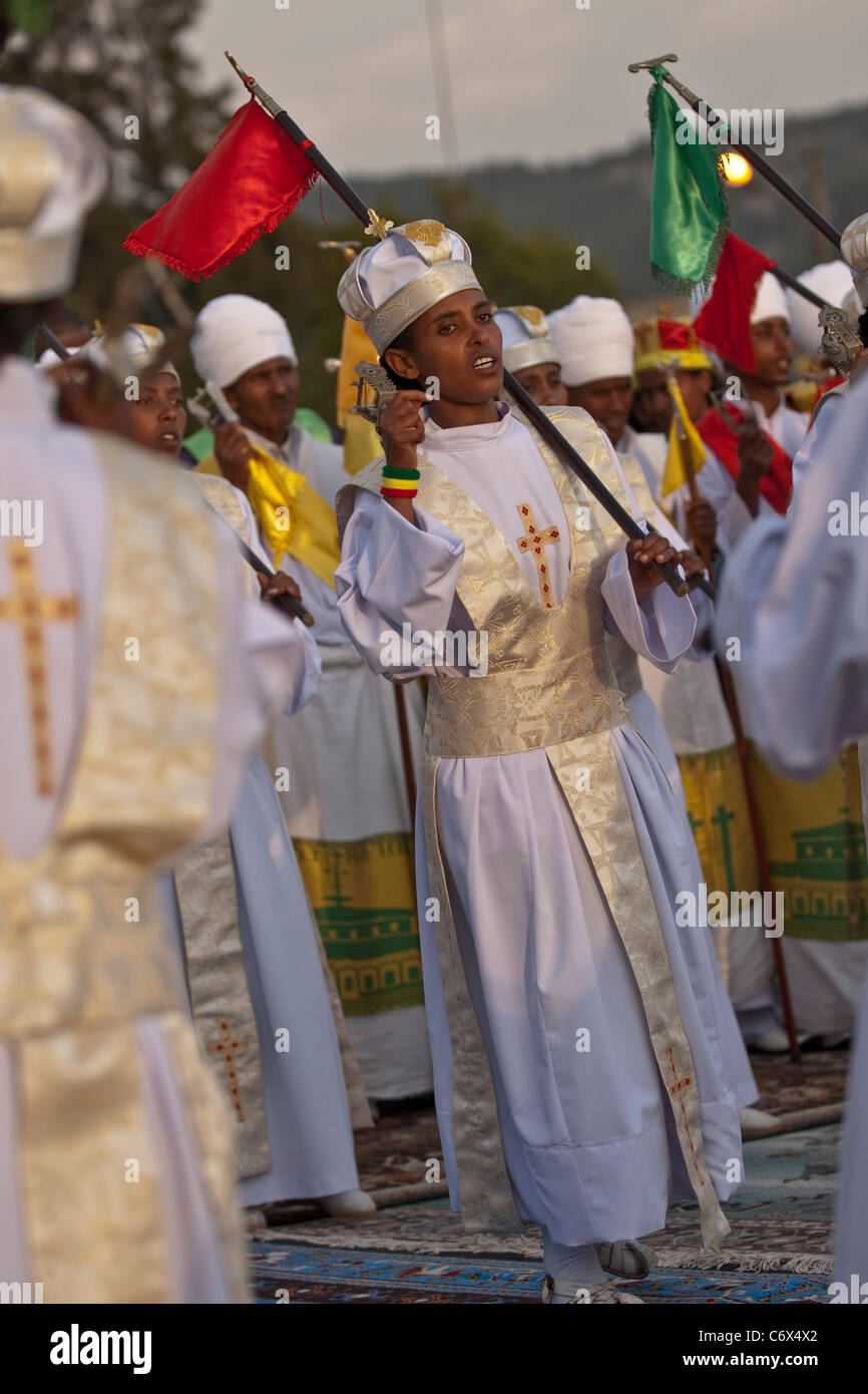 Christian Orthodox devotees standing in line with their canes and ...