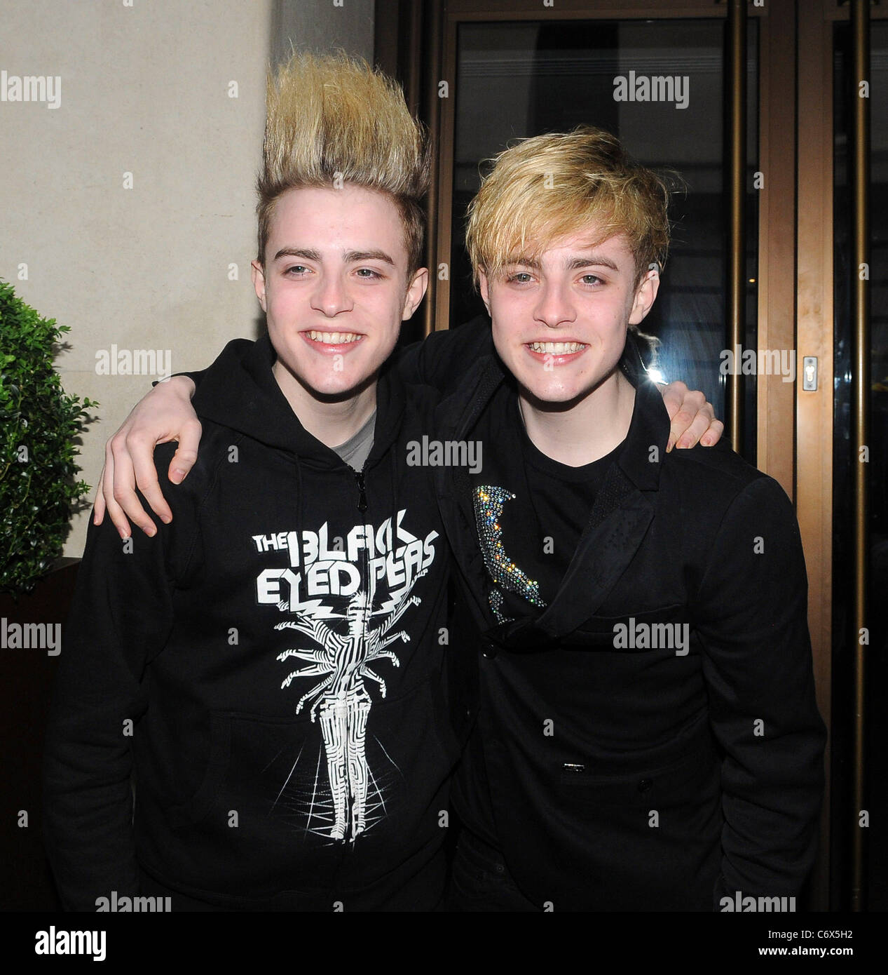 John and Edward Grimes, aka Jedward, pose for pictures with fans ...