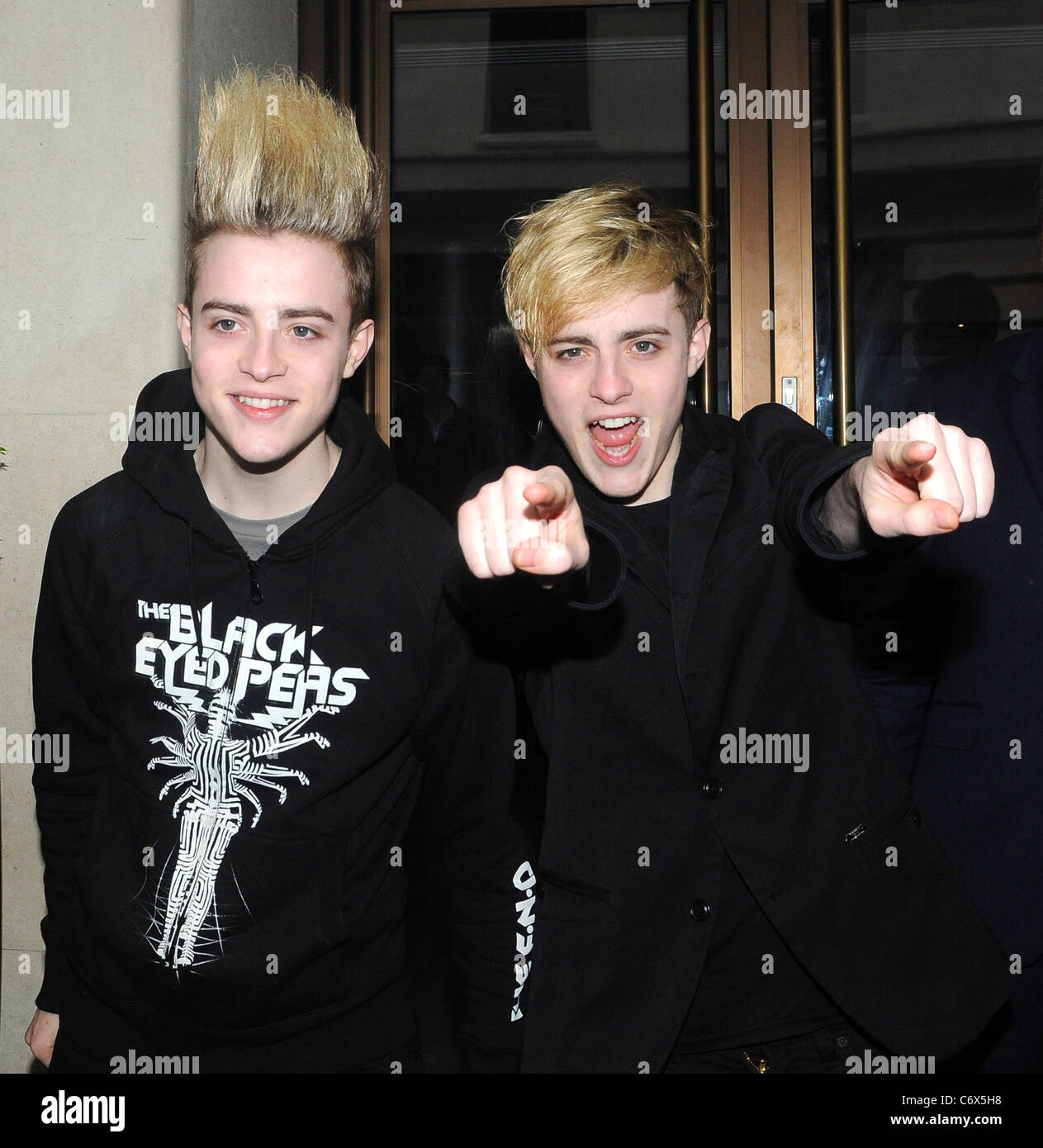 John and Edward Grimes, aka Jedward, pose for pictures with fans ...
