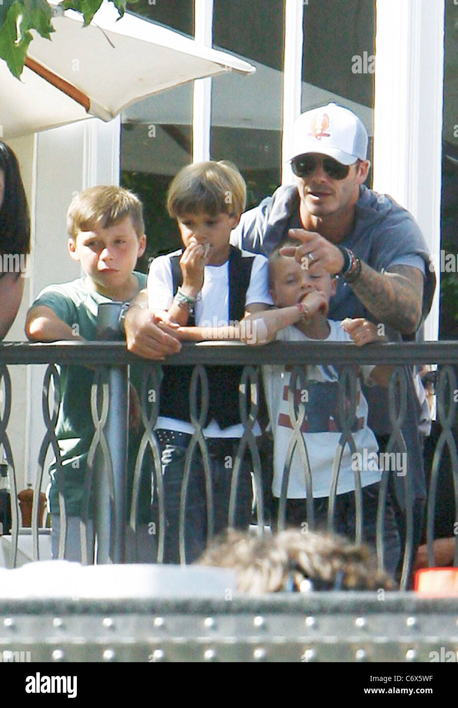 David Beckham with his sons Cruz, Romeo and Brooklyn watch the Jonas ...
