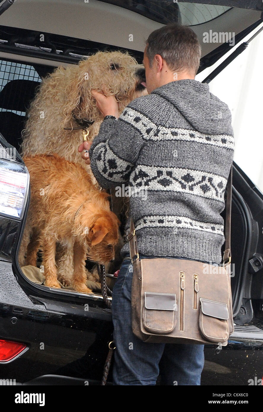 Graham Norton kisses his dog as he arrives at the Fountain Studios to ...