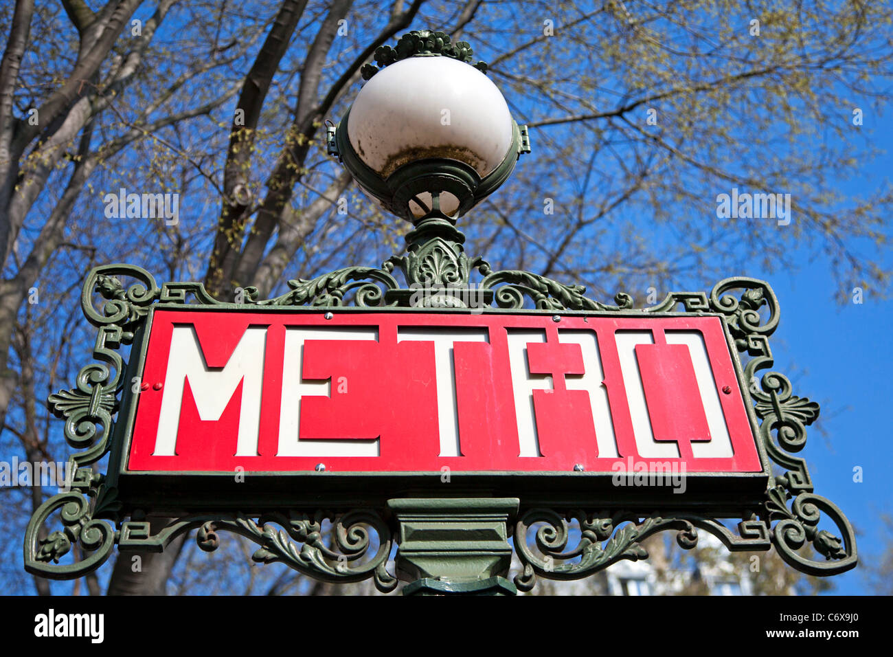 Paris metro sign with trees and sky background Stock Photo - Alamy
