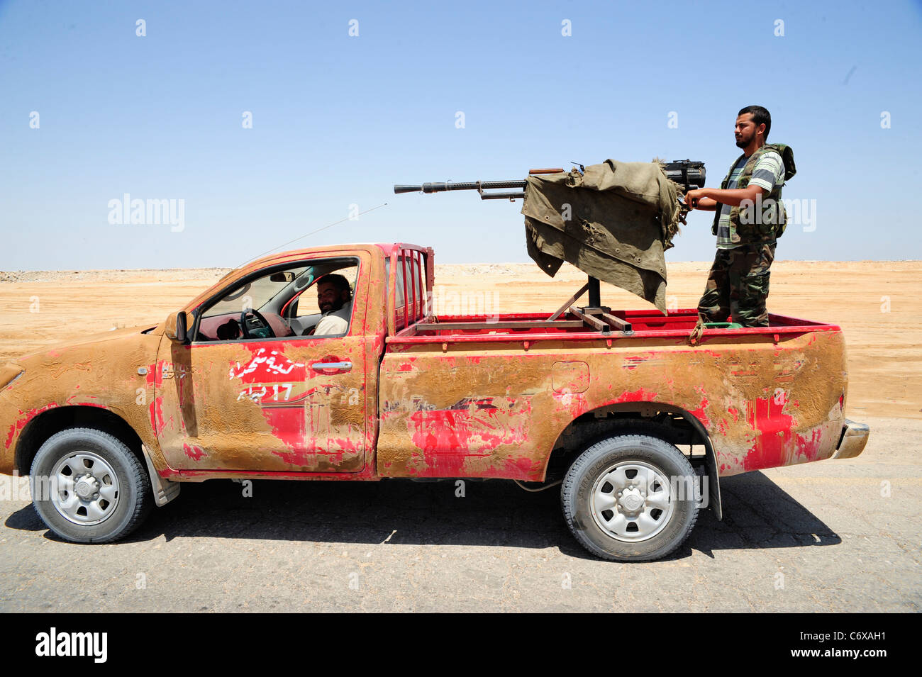 A civil war between Gaddafi army and Libya's Transitional National Council army with air support ...