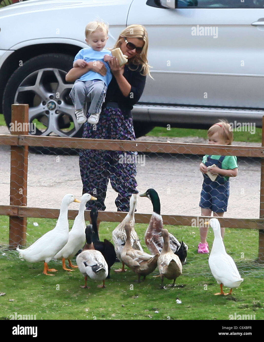 Kerry Katona feeding the ducks with her children Max and Heidi Sussex ...