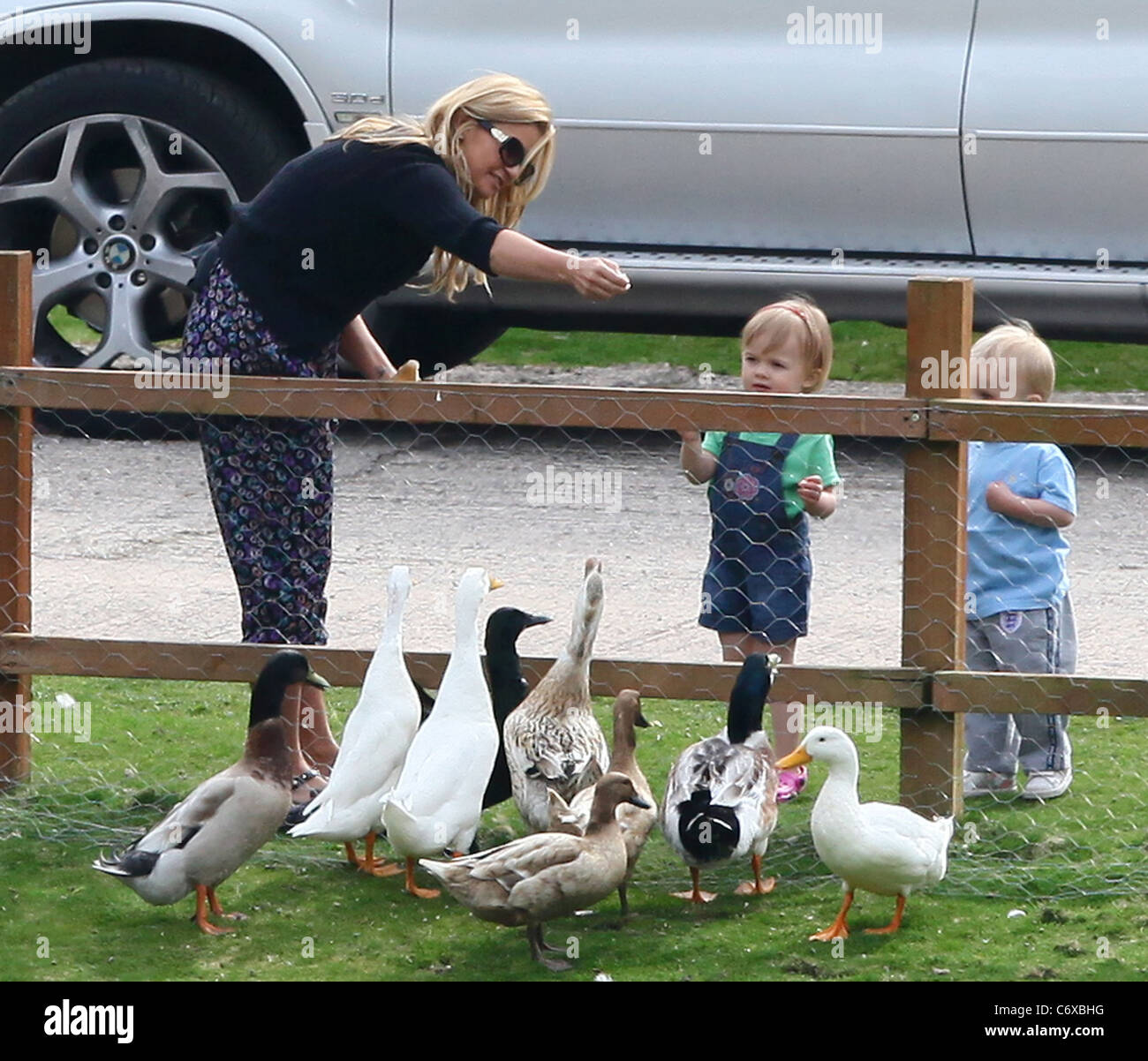 Kerry Katona feeding the ducks with her children Max and Heidi Sussex ...