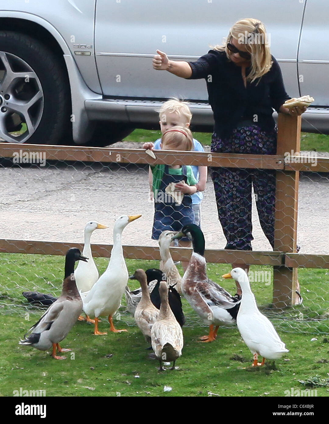 Kerry Katona feeding the ducks with her children Max and Heidi Sussex ...