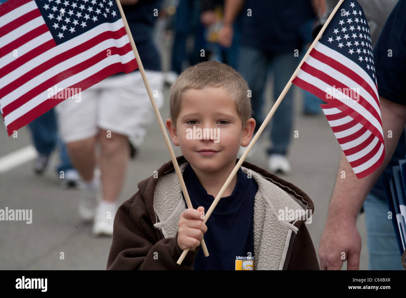 Detroit, Michigan - A boy with flags in the Labor Day parade Stock ...