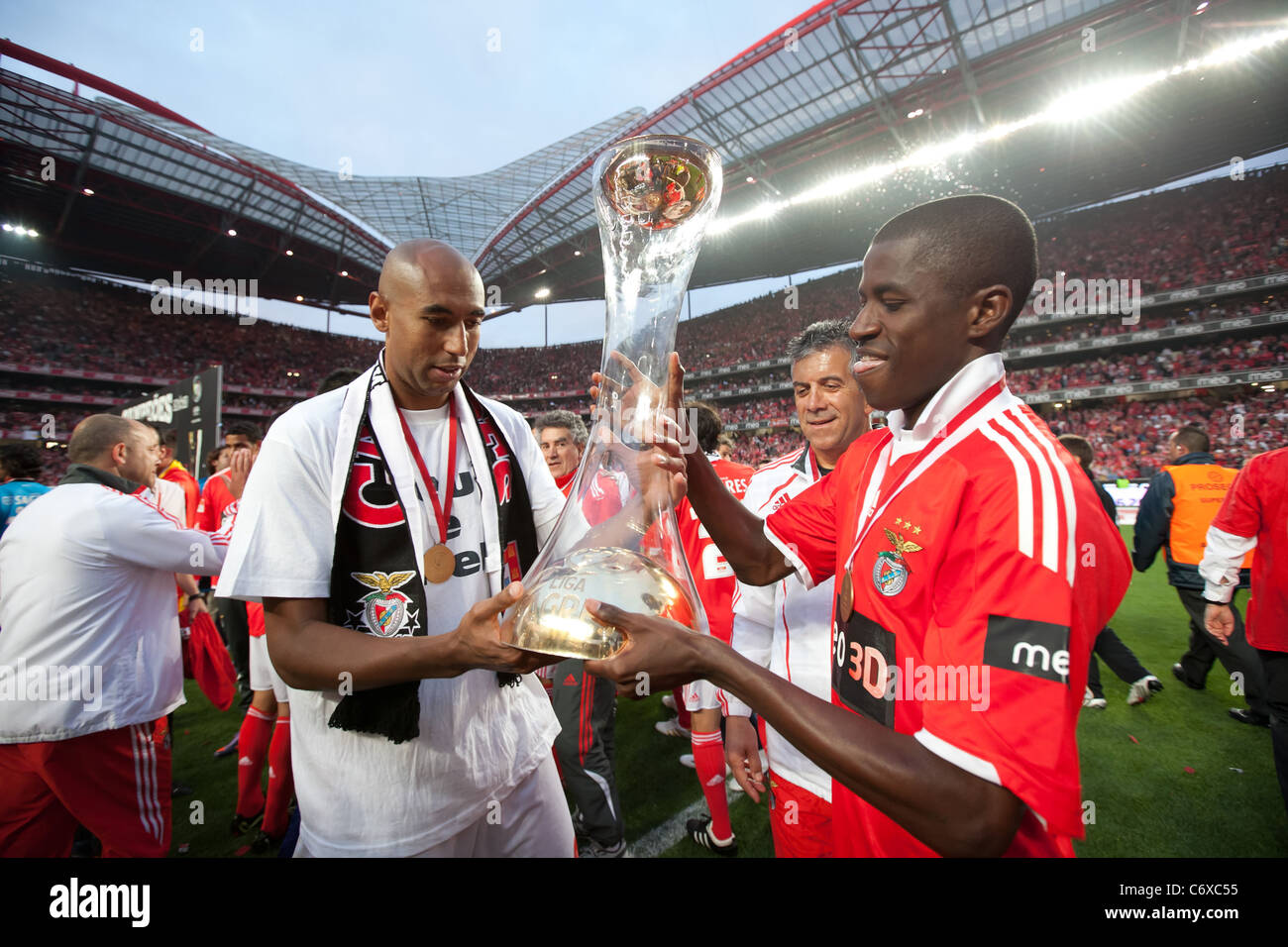 Ramires and Luisao holding the title trophy S. L. Benfica became champions of the Portuguese ...