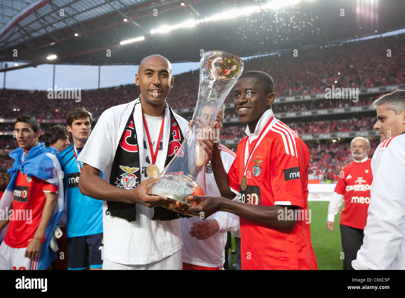 Ramires and Luisao holding the title trophy S. L. Benfica became ...