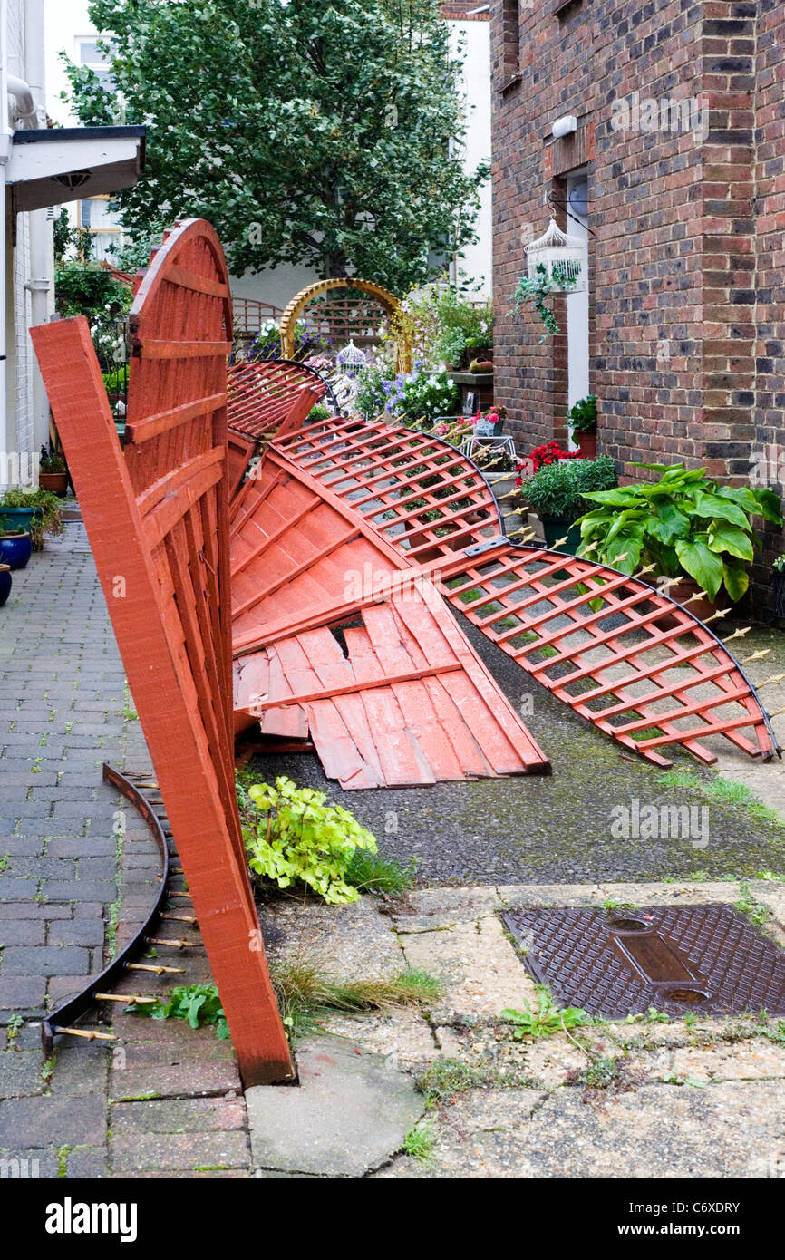garden fence blown down during wind and rain Stock Photo - Alamy