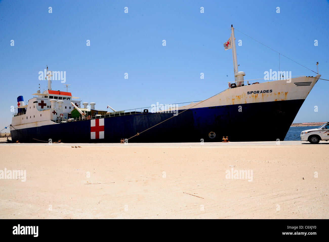 a red cross ship in the dock at Benghazi ready to sail Stock Photo - Alamy
