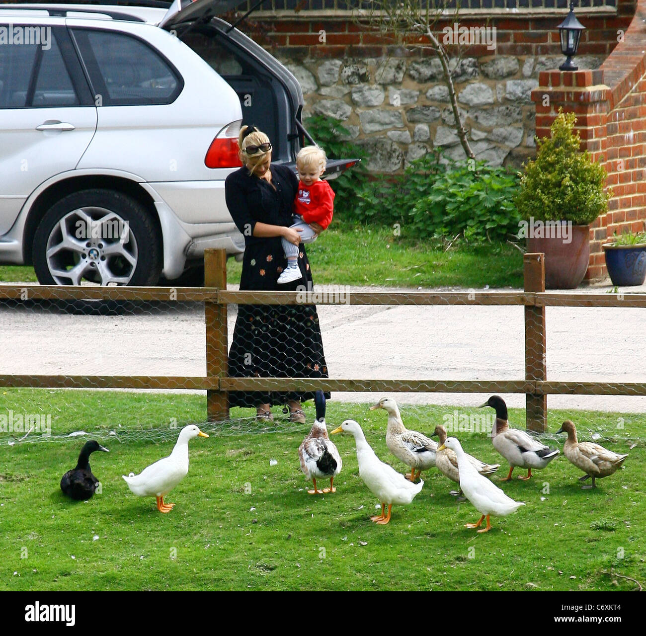 Kerry Katona and her son Max in the front garden of their new Surrey ...