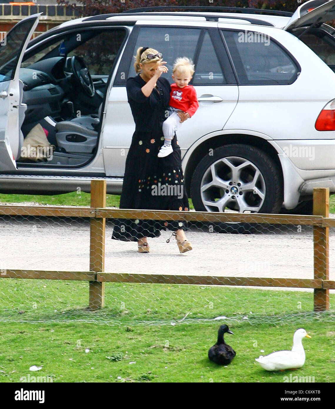 Kerry Katona and her son Max in the front garden of their new Surrey ...