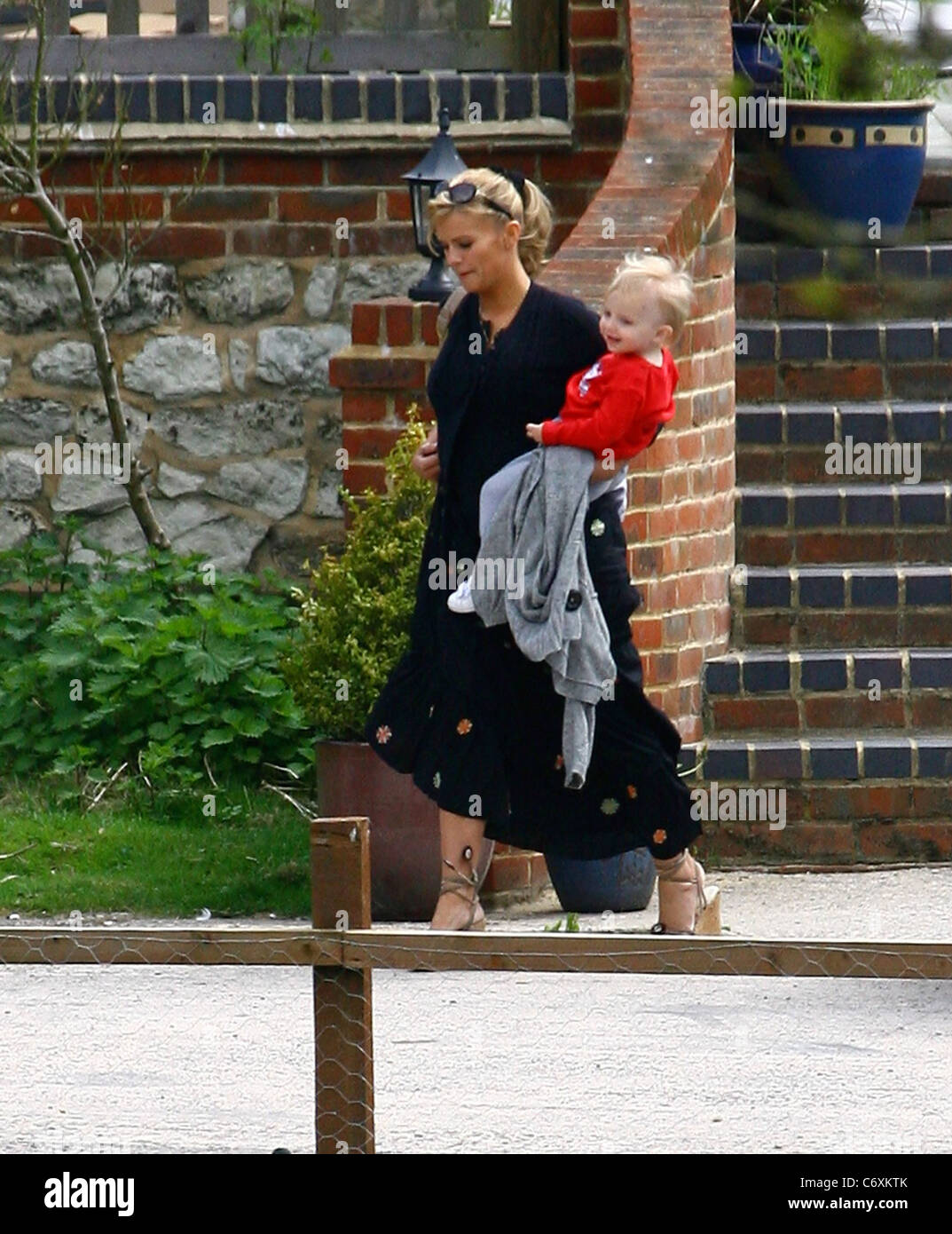 Kerry Katona and her son Max in the front garden of their new Surrey ...