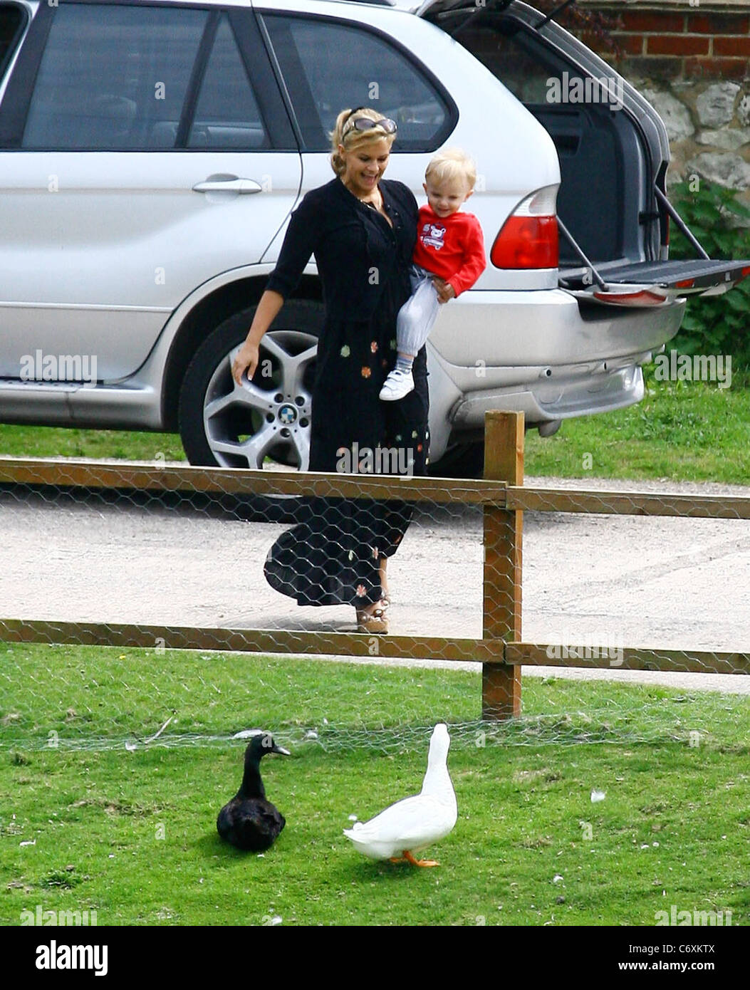 Kerry Katona and her son Max in the front garden of their new Surrey ...