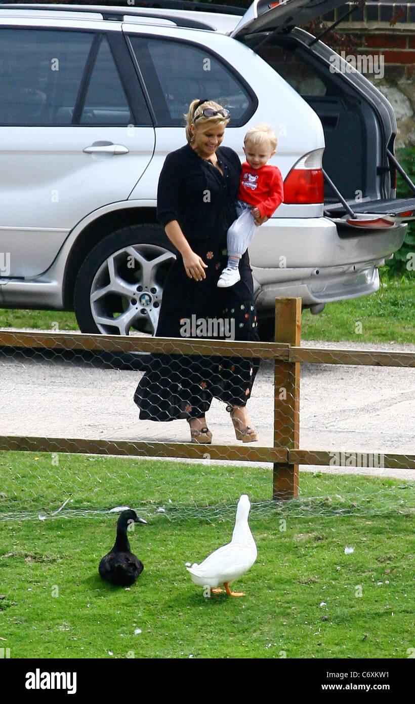 Kerry Katona and her son Max in the front garden of their new Surrey ...
