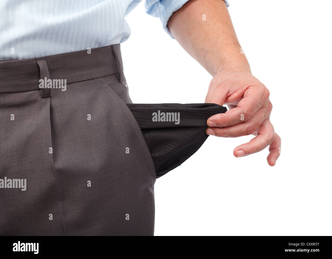 Businessman turning his empty pockets inside out, isolated on white ...