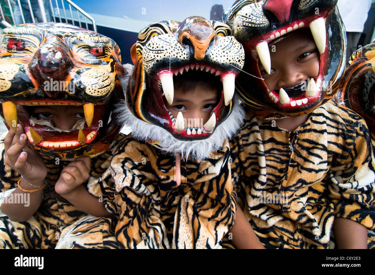 Tiger boys on procession day during a colorful festival in Bangkok ...