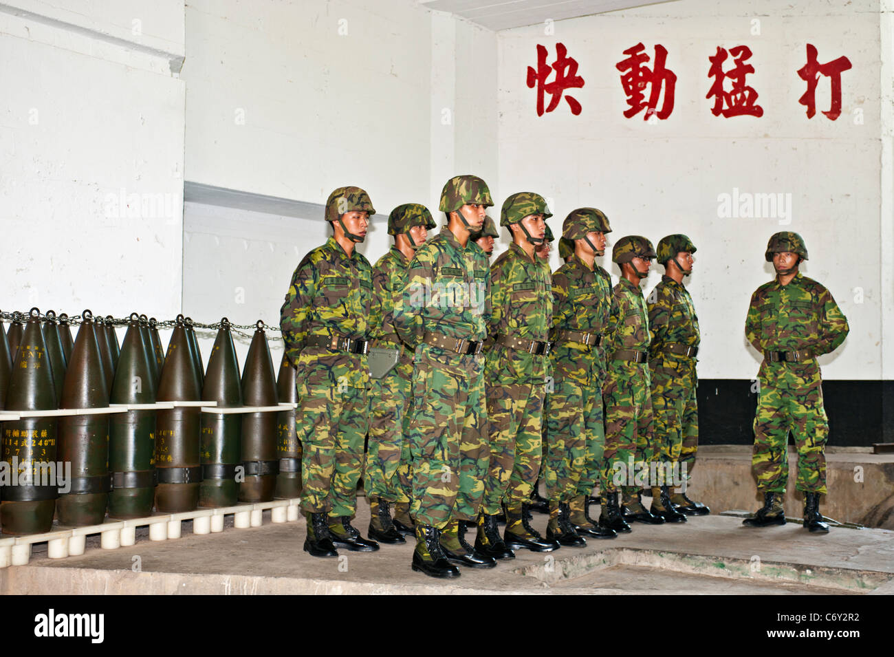 Taiwanese Soldiers guarding M1 240 mm Howitzer cannon shells in an army ...