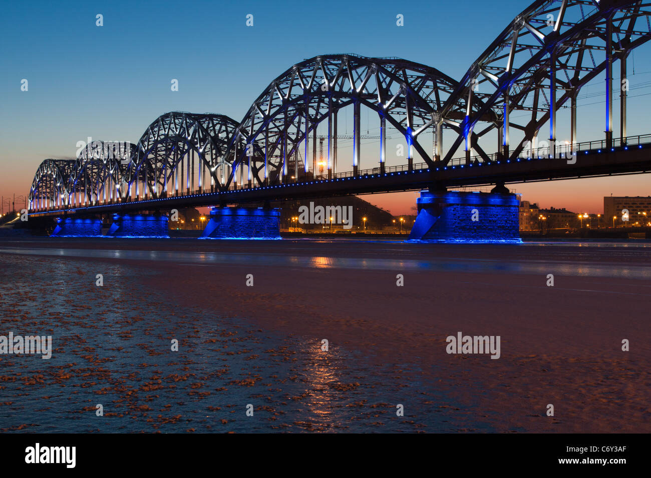 Railway bridge at night in winter close up Stock Photo - Alamy
