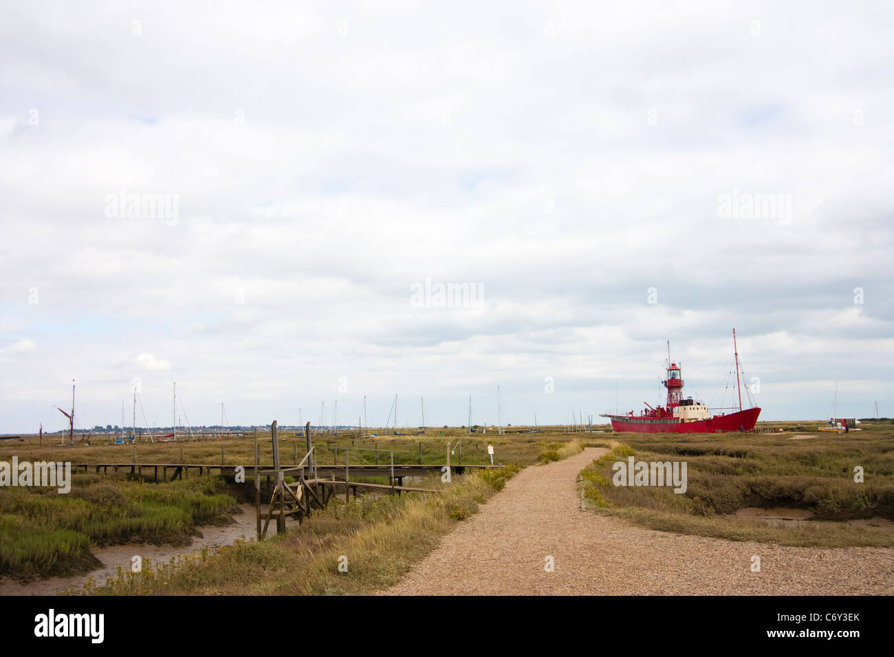 red boat in marshes in tollesbury essex Stock Photo - Alamy