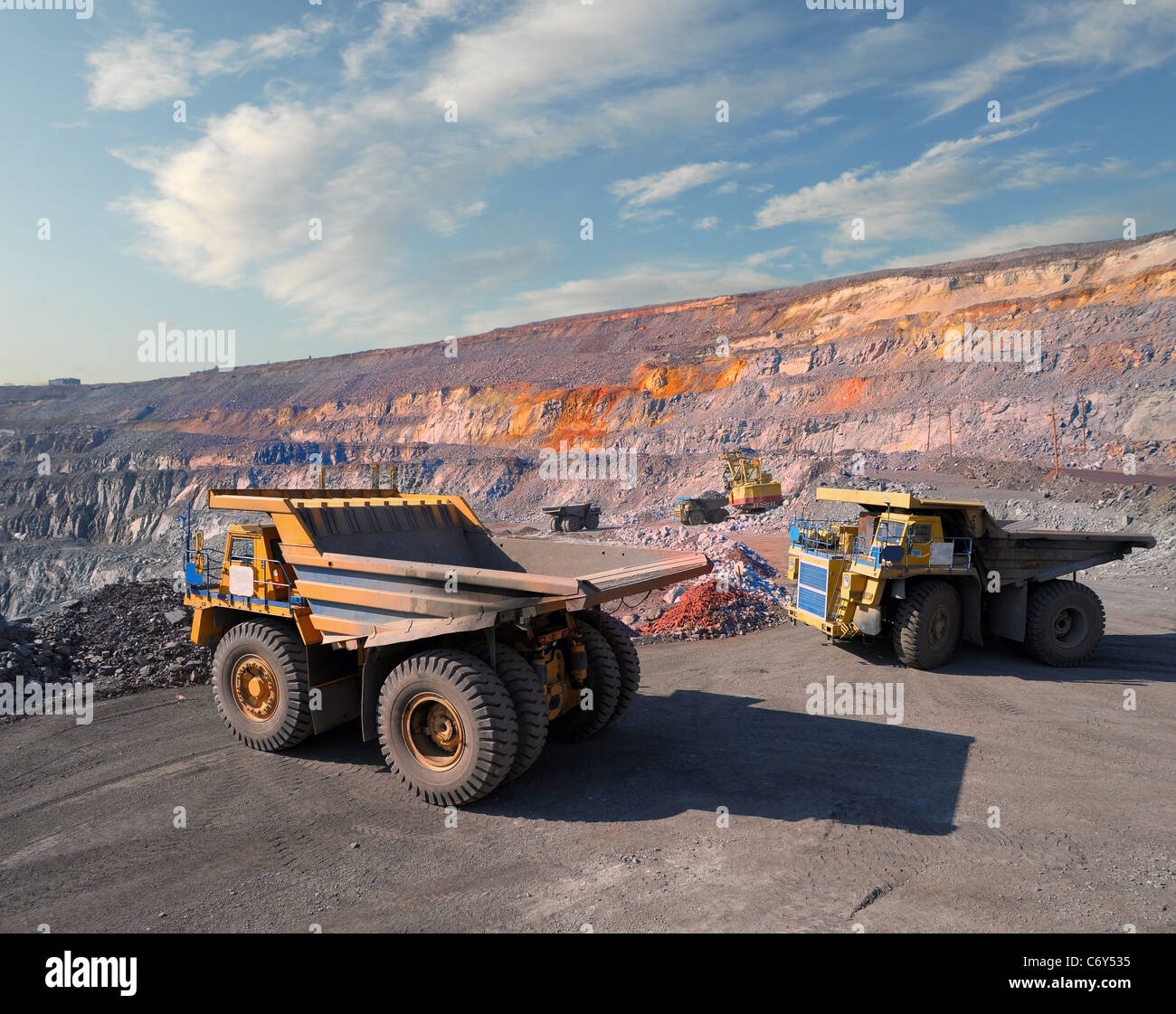 The big trucks transport iron ore in career Stock Photo - Alamy