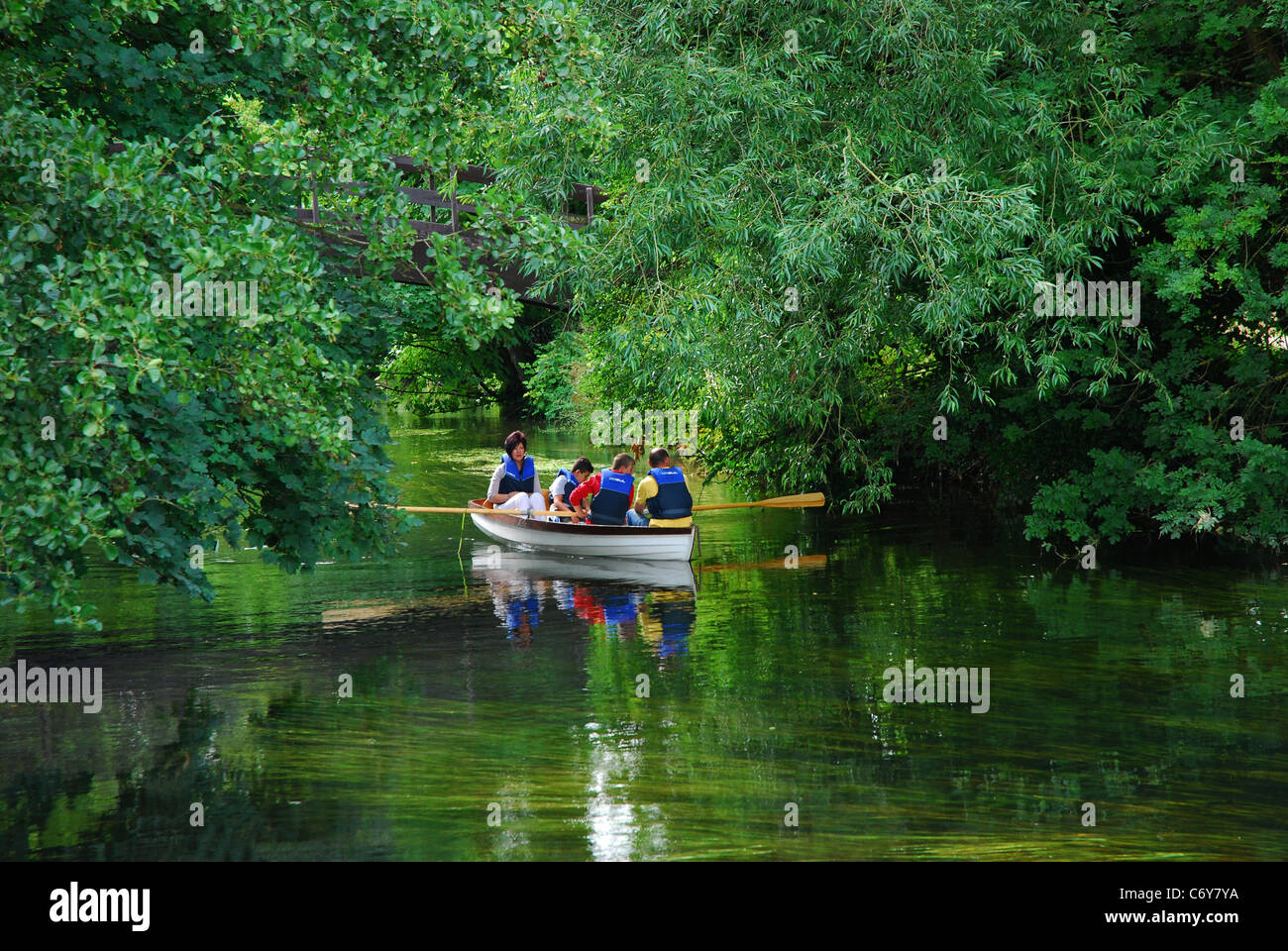 Family in row boat hi-res stock photography and images - Alamy