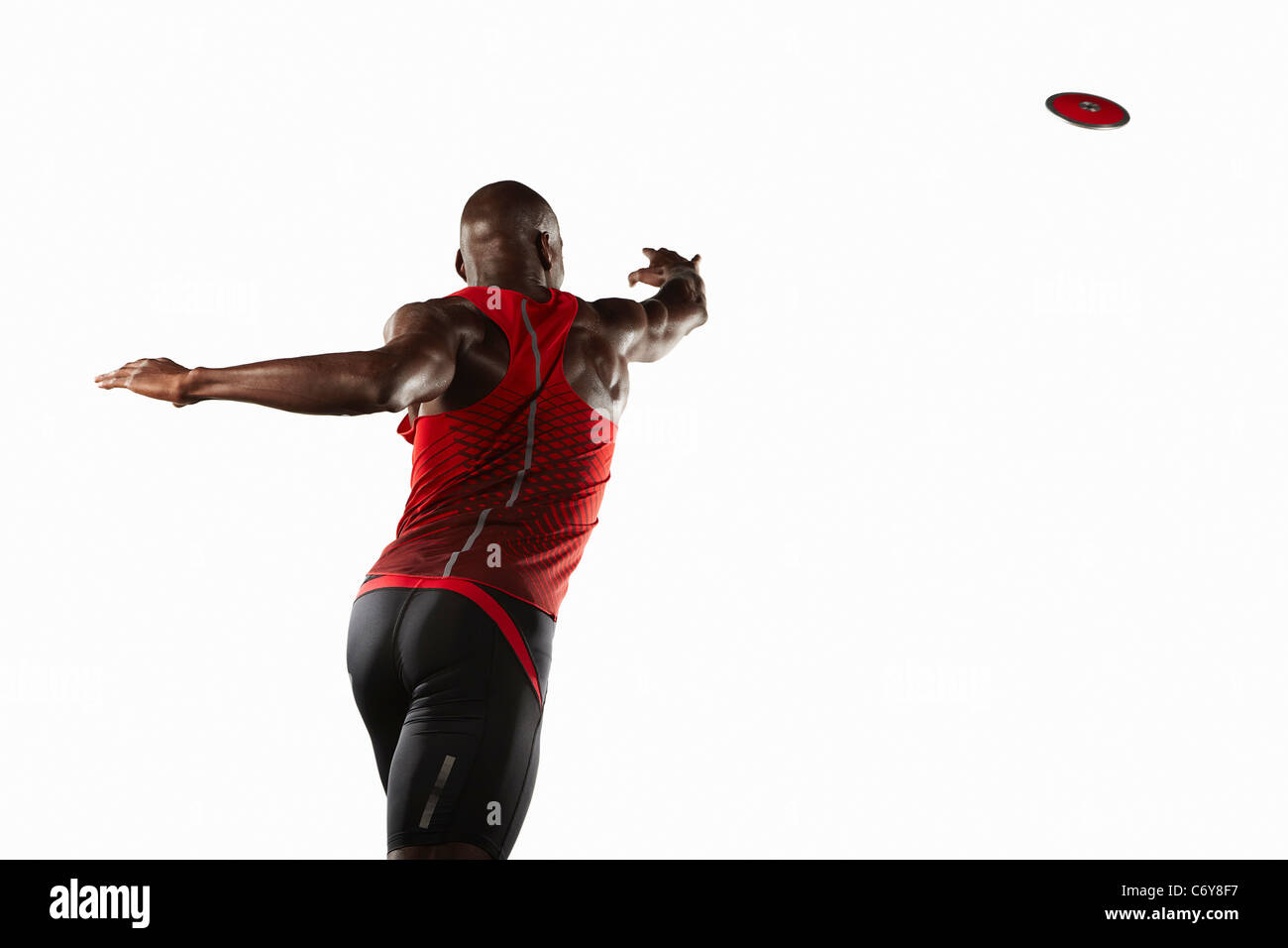 Athlete throwing discus Stock Photo - Alamy