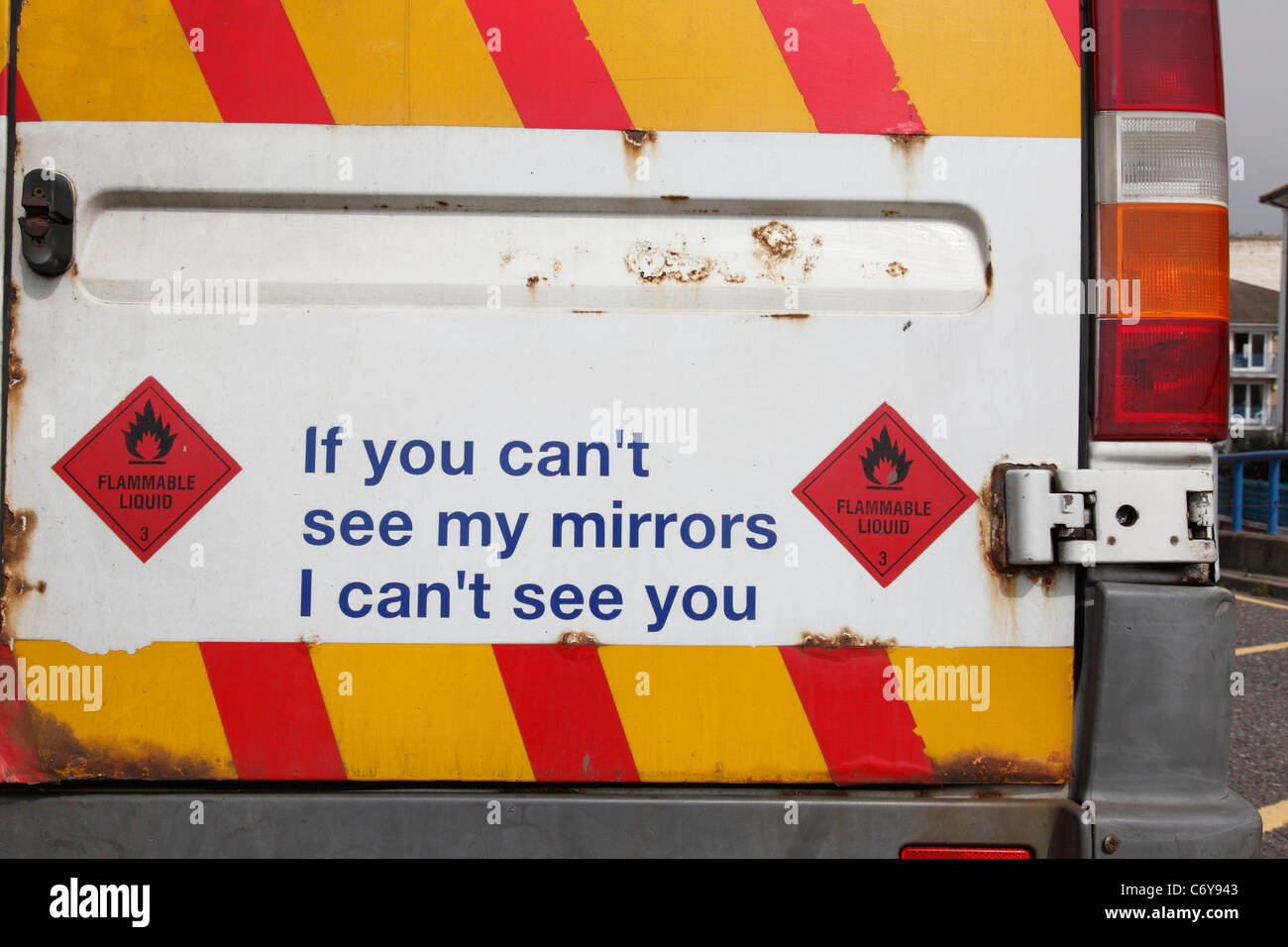 A road safety warning sign on the rear doors of a Ford Transit van ...
