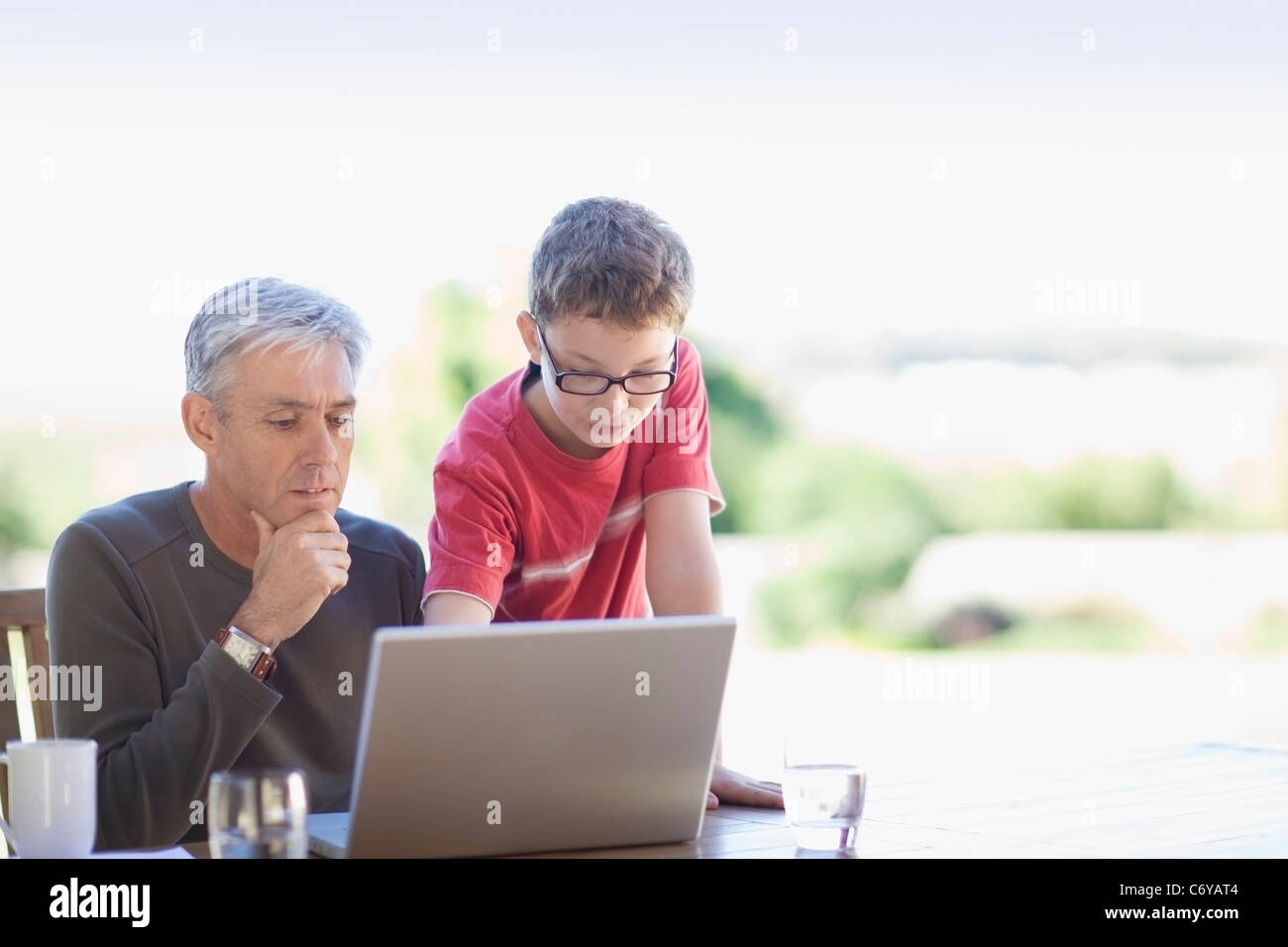 Grandfather and grandson using laptop Stock Photo - Alamy