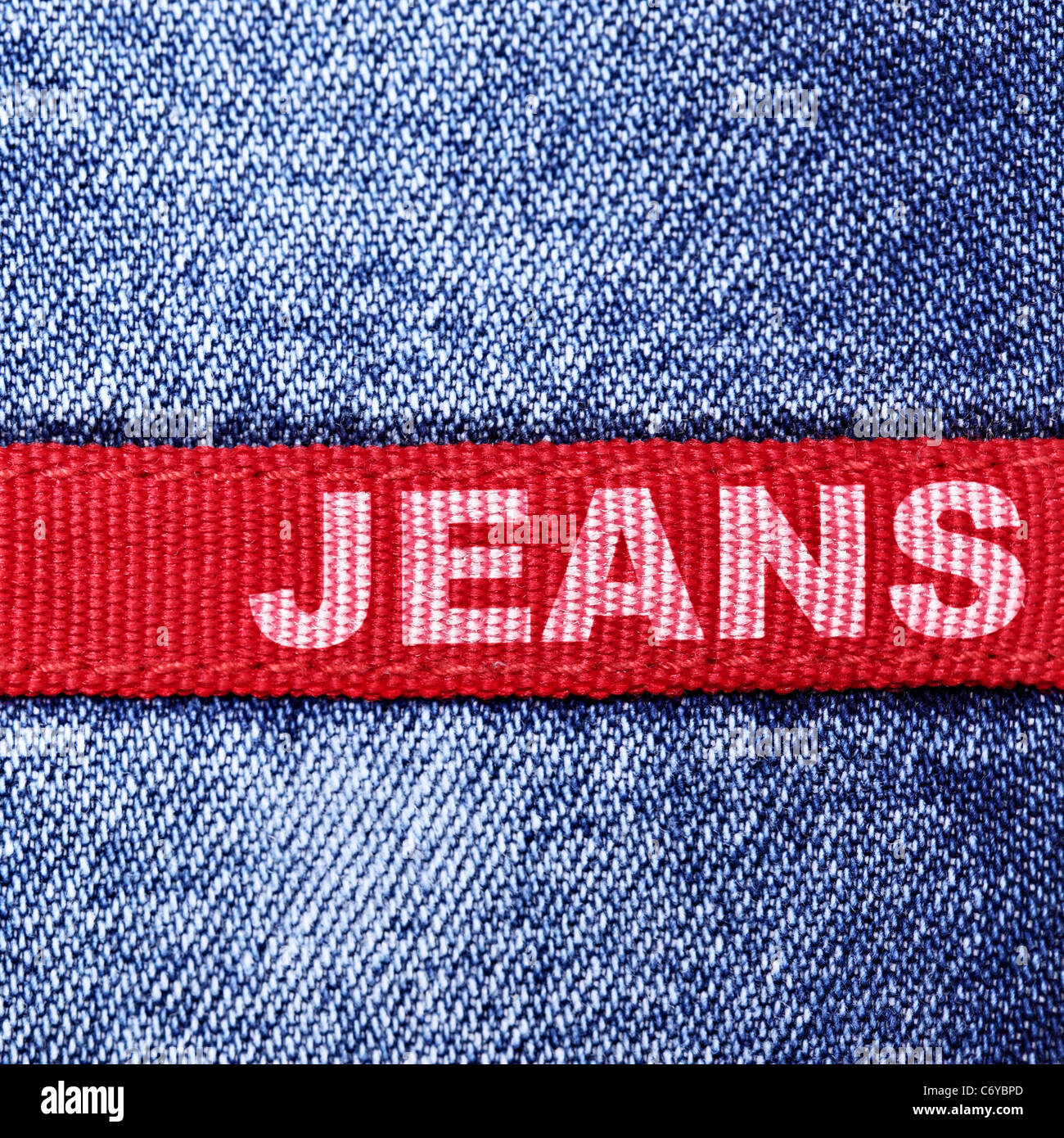 Blue jeans and red label with word "Jeans Stock Photo - Alamy