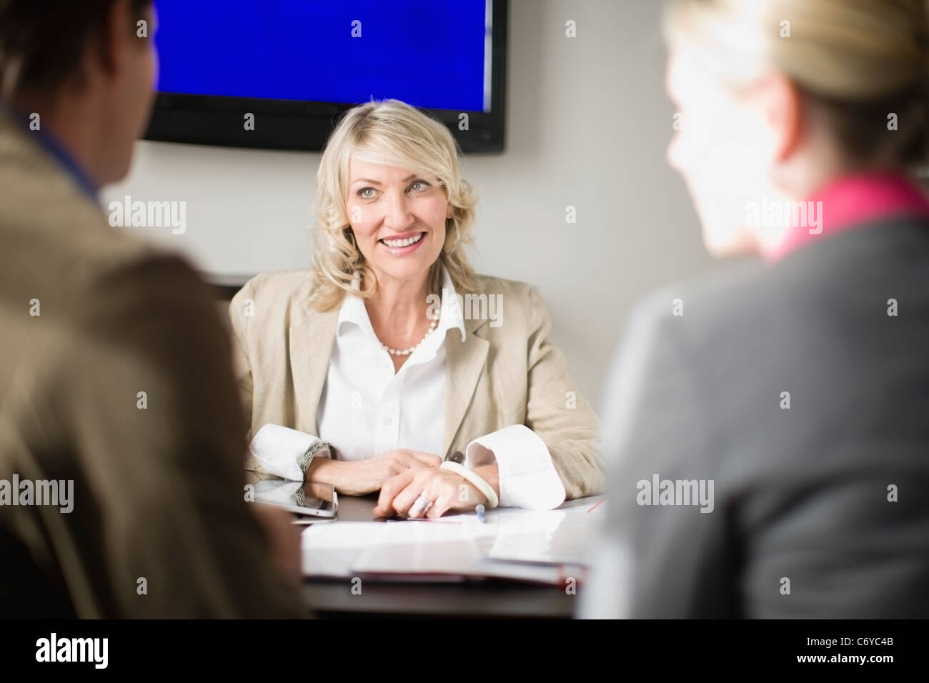 Business people talking in office Stock Photo - Alamy