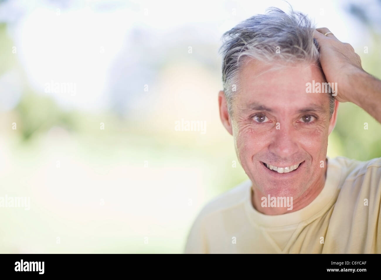 Man smiling outdoors Stock Photo - Alamy