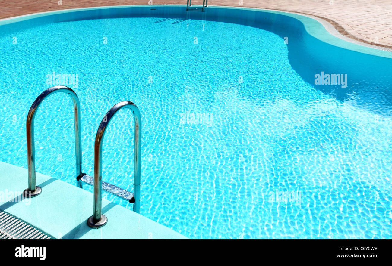 Swimming pool with stair at a hotel Stock Photo - Alamy