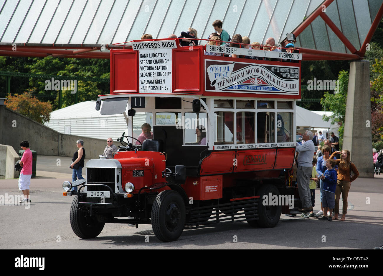 Number 11 vintage bus with passengers embarking outside the National ...