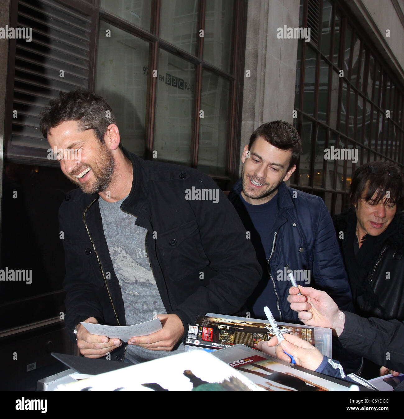 Gerard Butler signs autographs outside the Radio One studios London ...