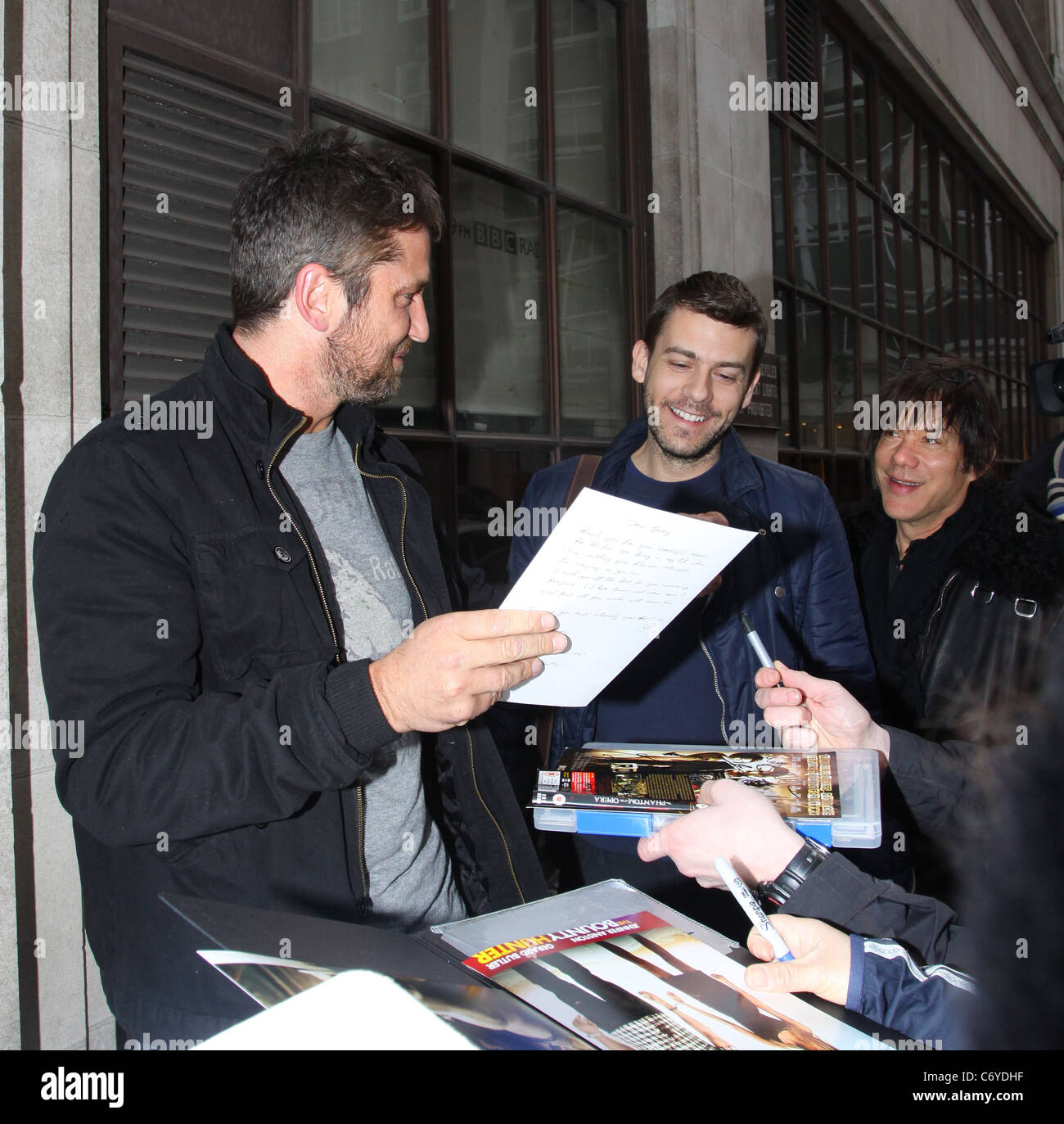 Gerard Butler signs autographs outside the Radio One studios London ...