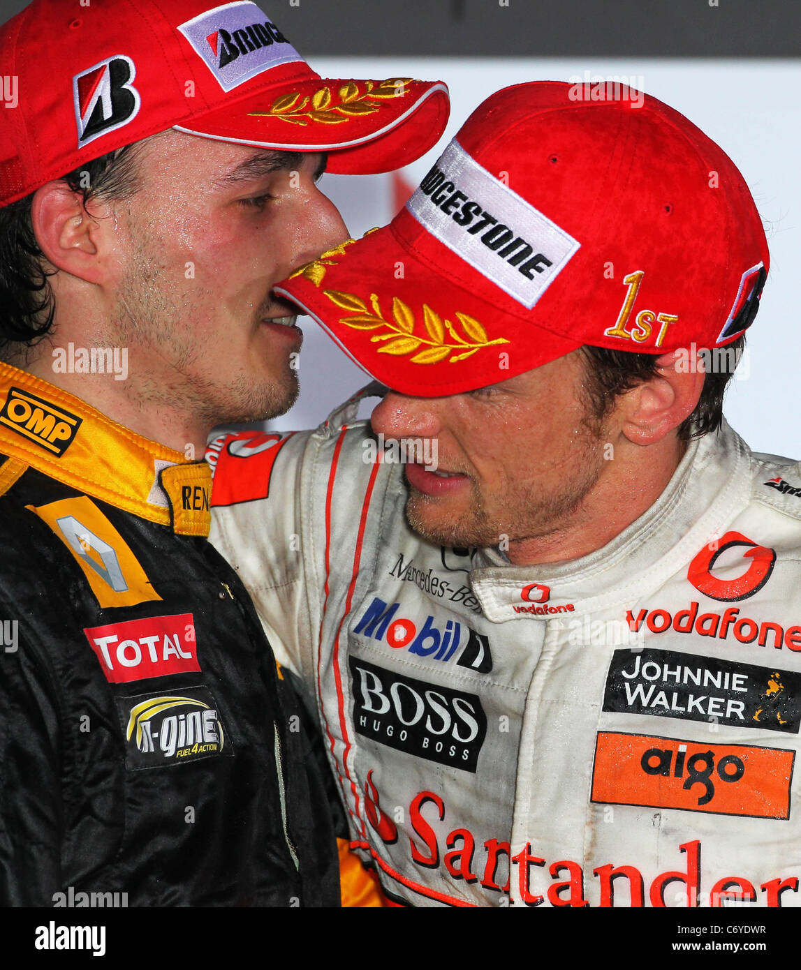 Robert Kubica and Jenson Button celebrate on the podium after The ...