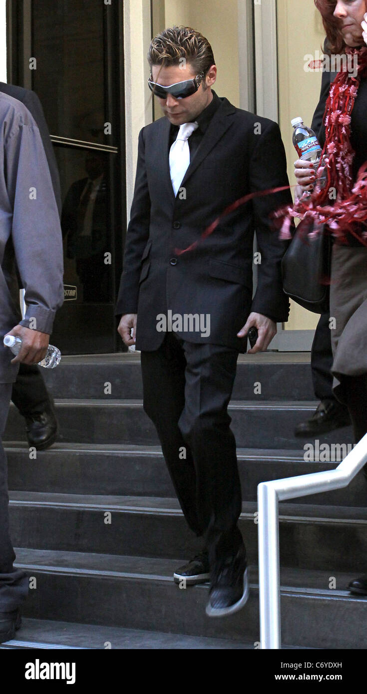 Corey feldman wearing a dark suit with a white tie hi-res stock ...