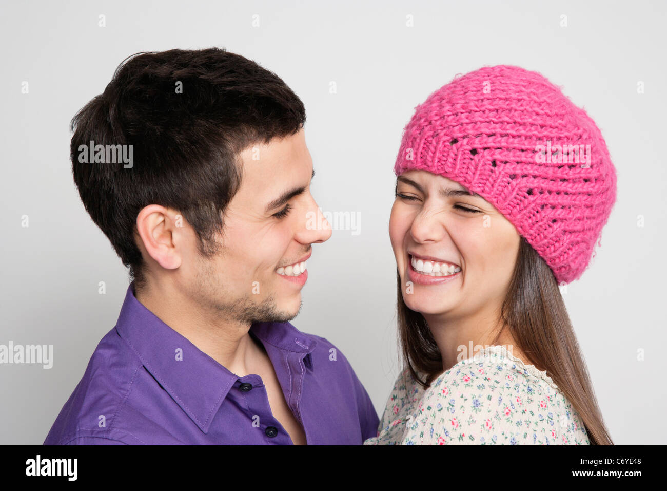 Laughing couple hugging Stock Photo - Alamy