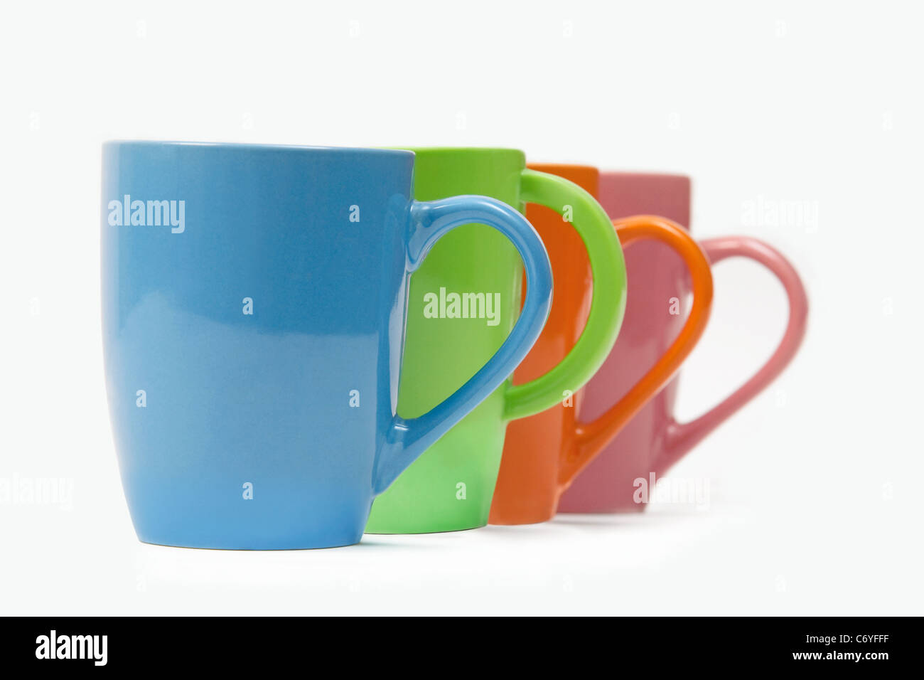 Colourful mugs in a row Stock Photo - Alamy