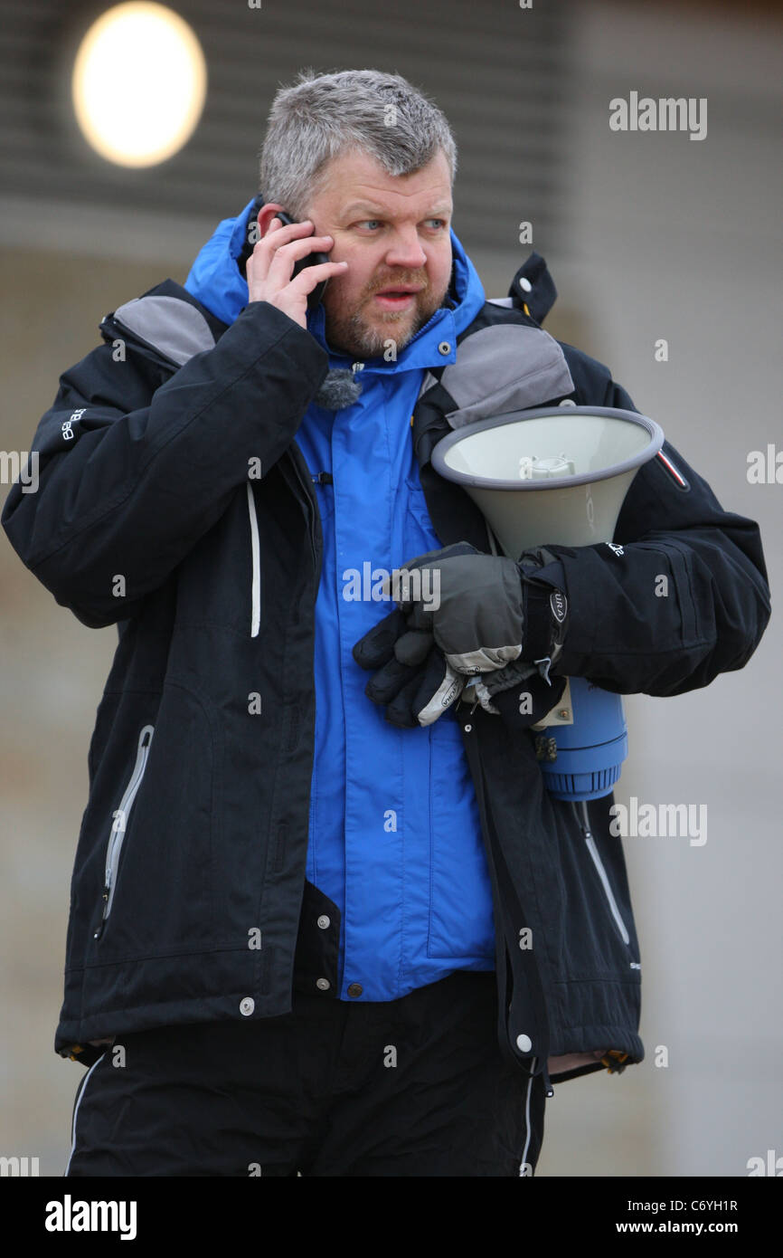 Adrian Chiles gets ready to help fellow presenter Christine Bleakley ...