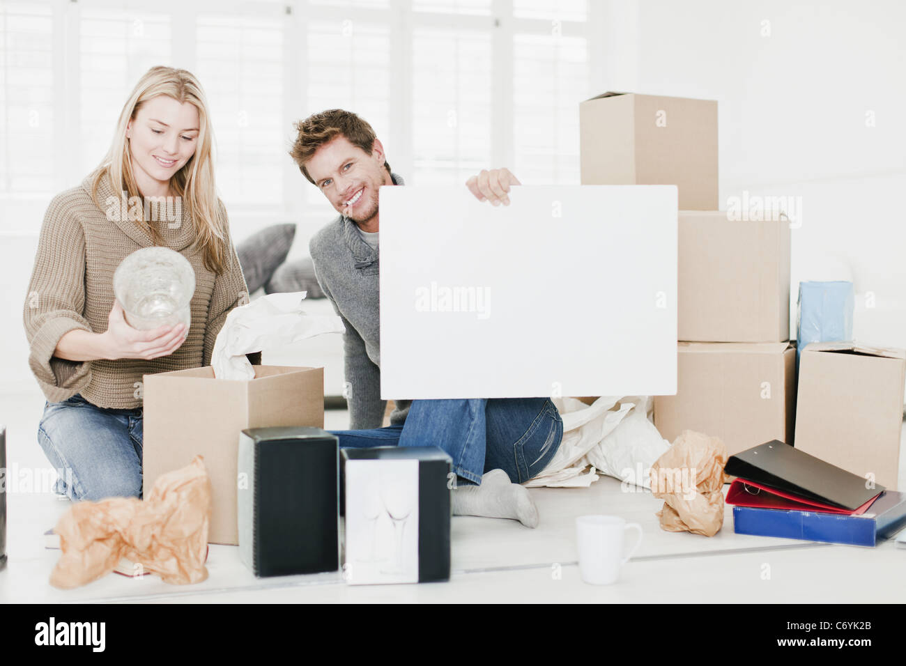 Young blonde woman unpacking hi-res stock photography and images - Alamy