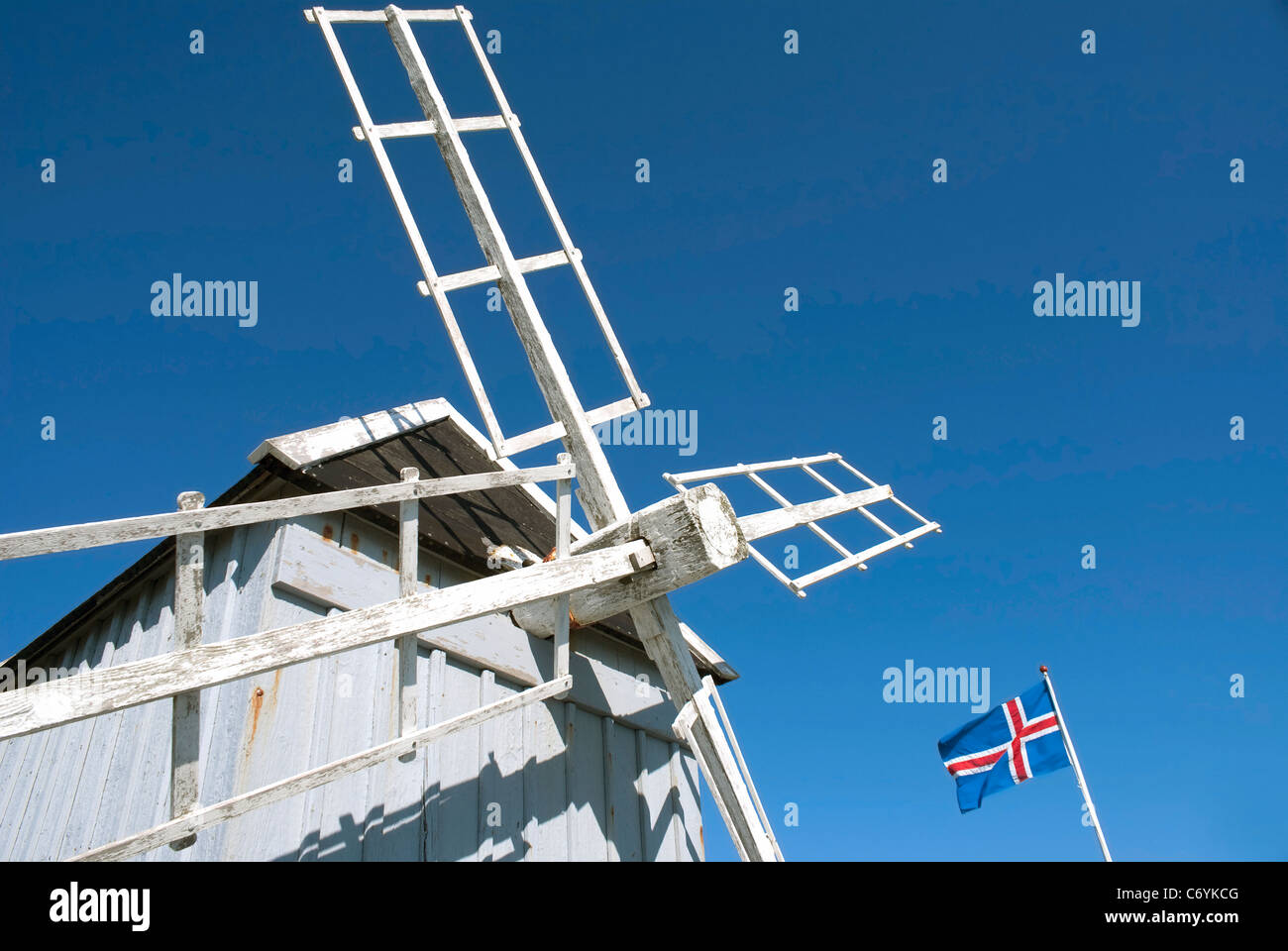 Traditional windmill at Vigur island, Iceland on a beautiful day with ...